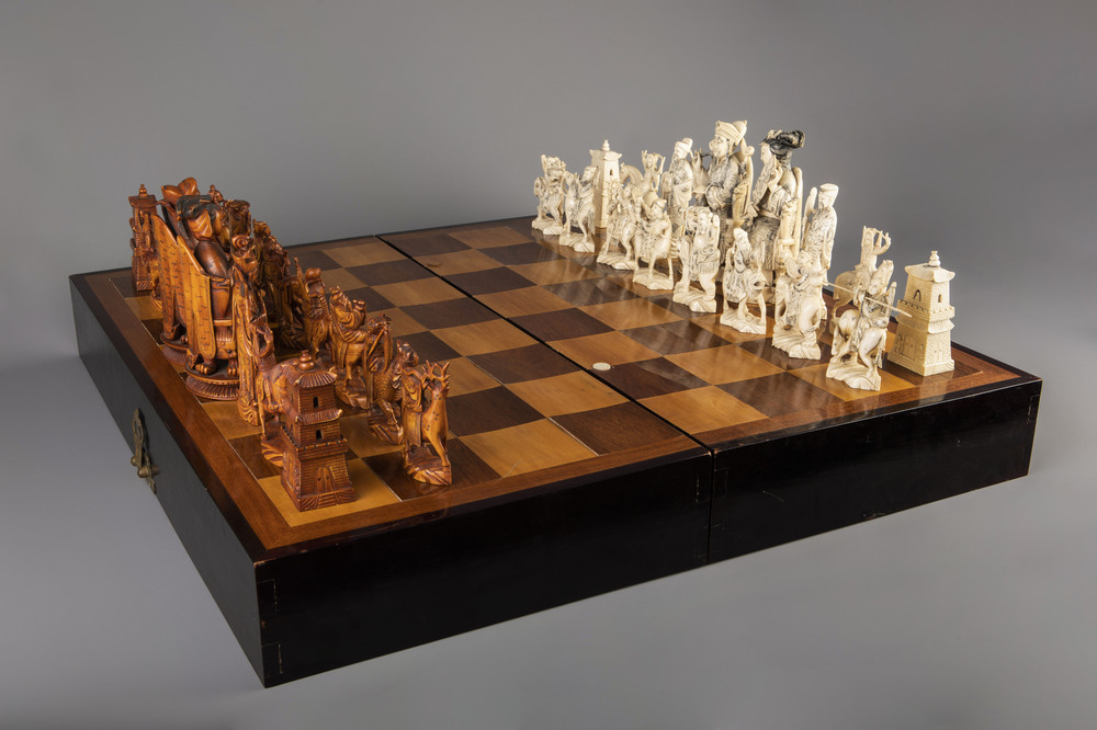 A large Chinese carved ivory chess set with board, second quarter 20th ...